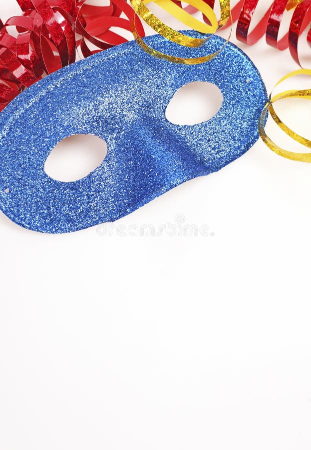 Colorful Streamers and Blue Glittering Mask on White Table Close Up ...