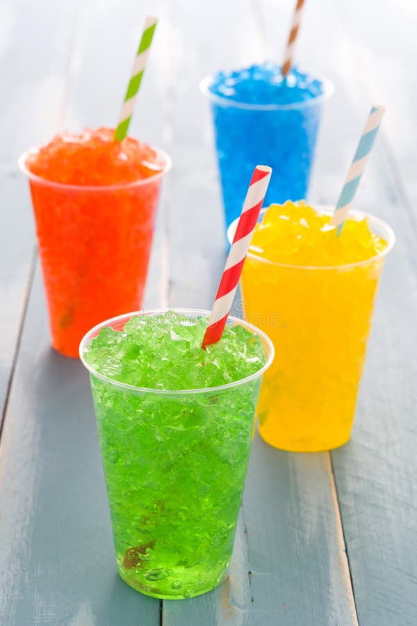 Colorful Summer Slushies on Blue Wood Stock Photo - Image of straws ...