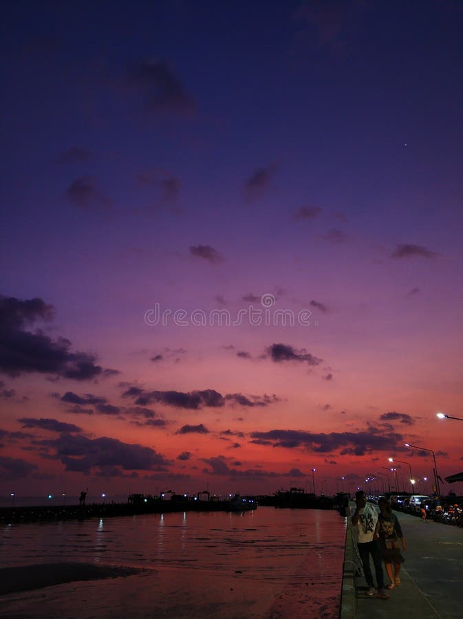 Colorful Sunset on the Beach. Reflection of the Sunset Sky in the Water ...