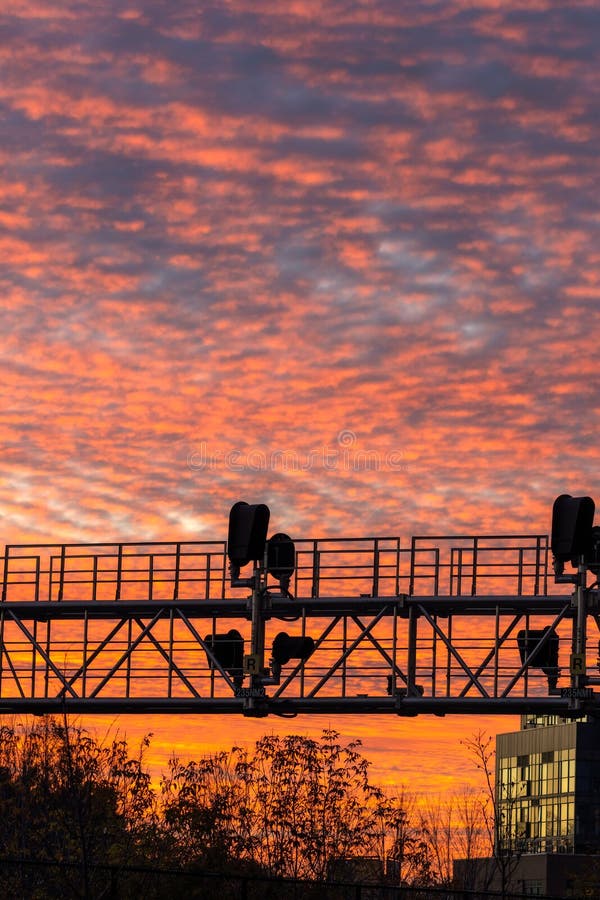 Colorful Sunset Behind a Railway Light Structure Stock Photo - Image of ...