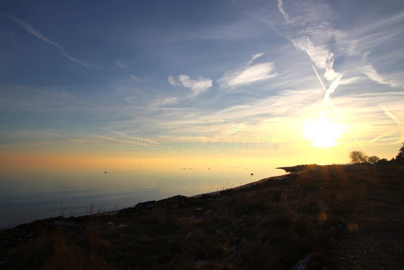 Colorful Sunset on a Cold Beach Stock Image - Image of water, golden ...