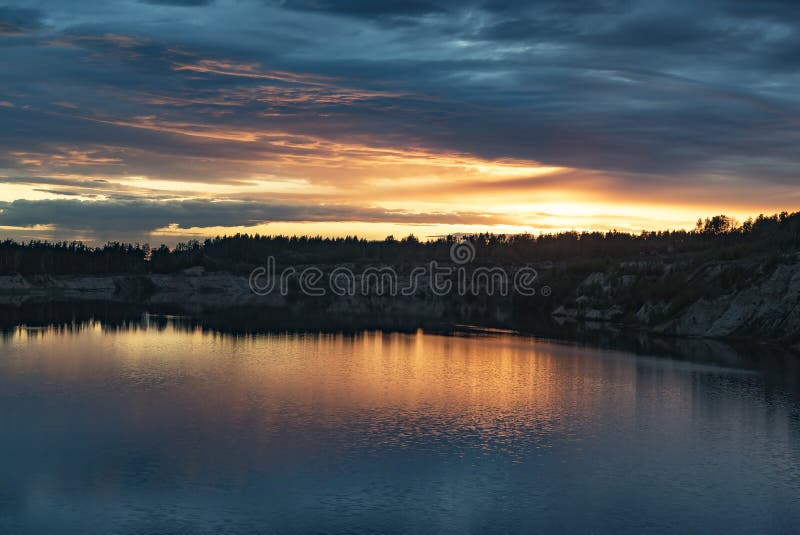 Colorful Sunset with a Mirror Reflection in a Forest Lake . Stock Image ...
