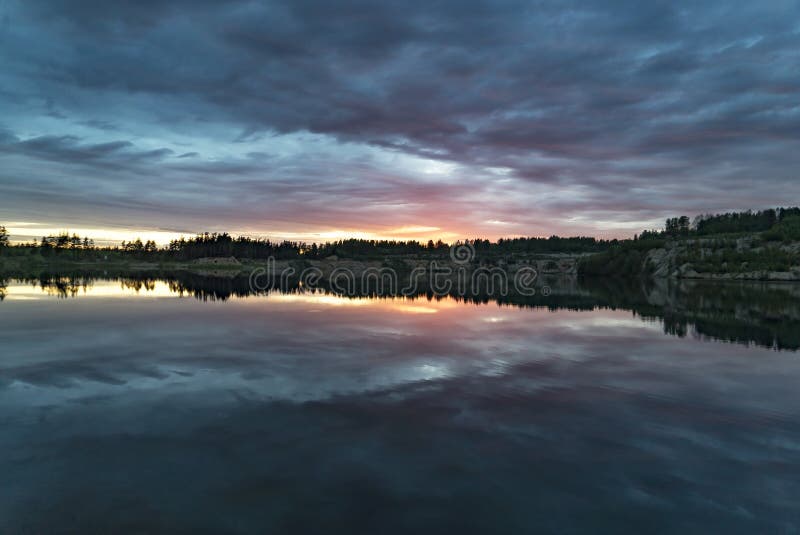 Colorful Sunset with a Mirror Reflection in a Forest Lake . Stock Photo ...