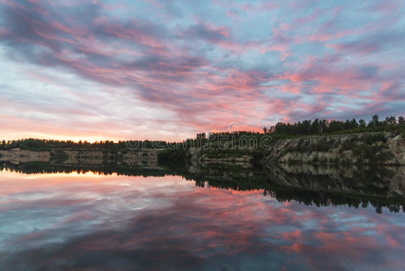 Colorful Sunset with a Mirror Reflection in a Forest Lake . Stock Image ...