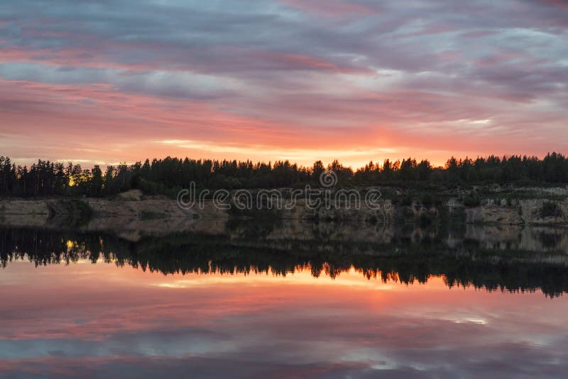 Colorful Sunset with a Mirror Reflection in a Forest Lake . Stock Image ...