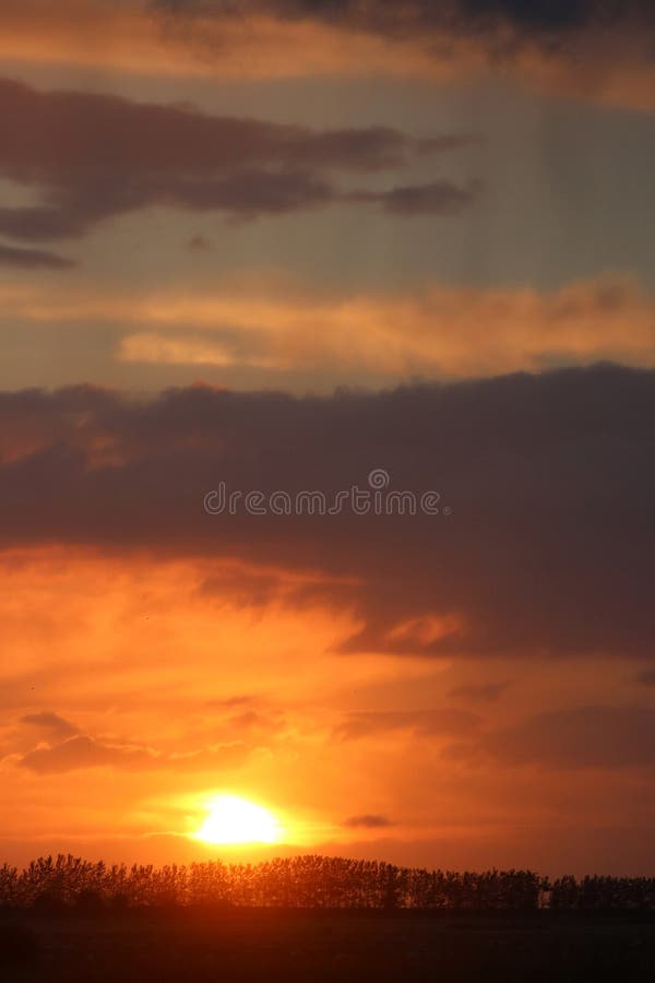 Colorful Sunset Under Dramatic Clouds in Sky Stock Image - Image of ...