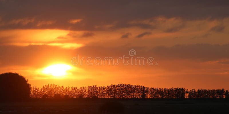 Colorful Sunset Under Dramatic Clouds in Sky Stock Image - Image of ...