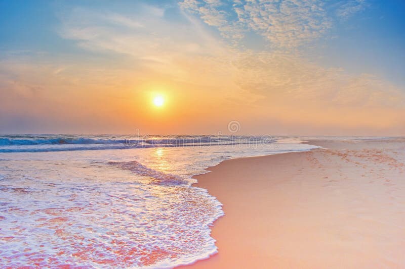 Colorful Sunset Viewed from the Pink Sea Beach with Soft Waves Stock ...
