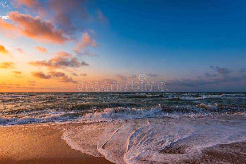 Colorful Sunset with Wave Splashes on Tbeach Stock Image - Image of ...