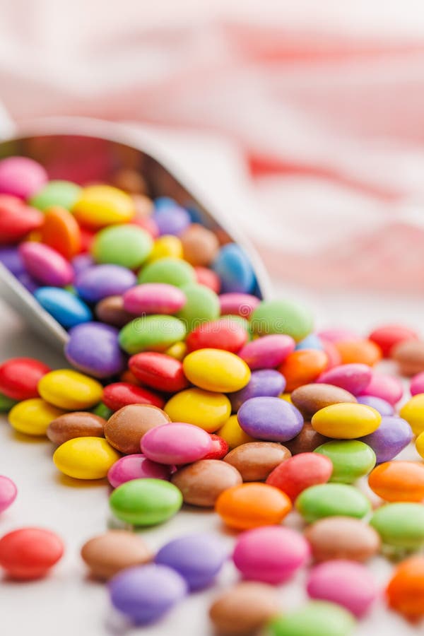 Colorful Sweet Candies in Scoop on White Table Stock Image - Image of ...
