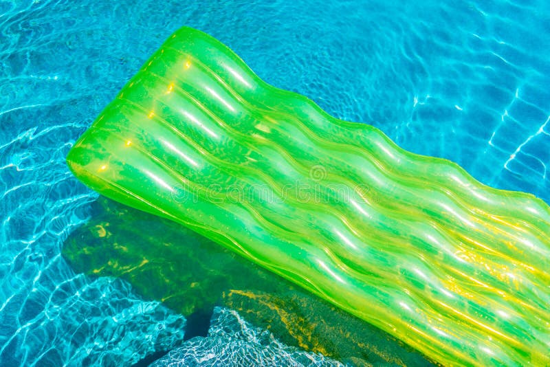 Colorful Swim Ring or Rubber Float Around Swimming Pool Water Stock ...