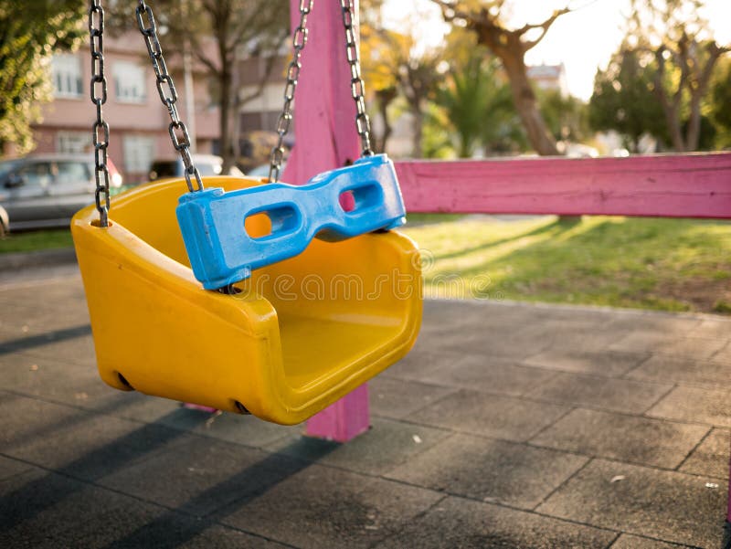Colorful Swing Set at Playground in a Park Stock Photo - Image of ride ...