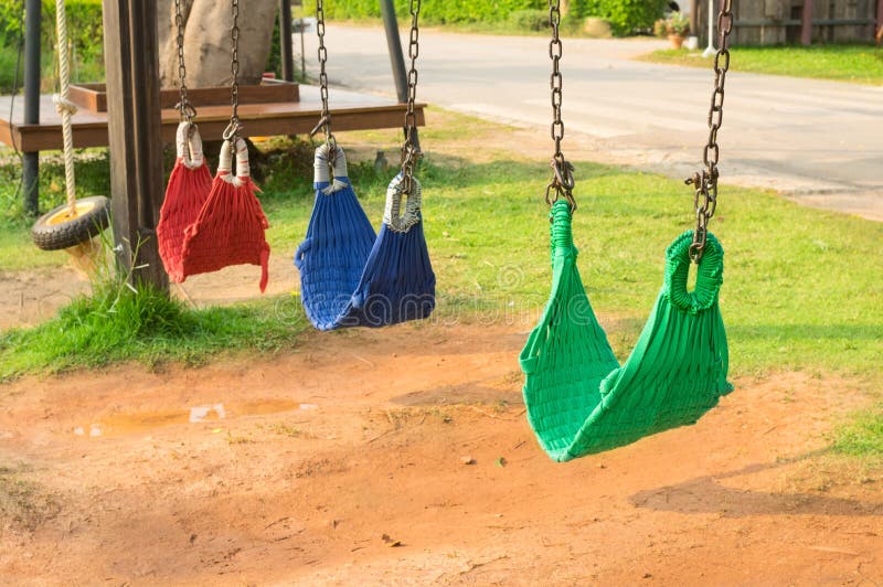 Colorful Swings in Playground Stock Image - Image of children, swinging ...