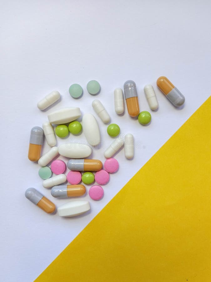 Colorful Tablets with Capsules and Pills on White Background. Stock ...