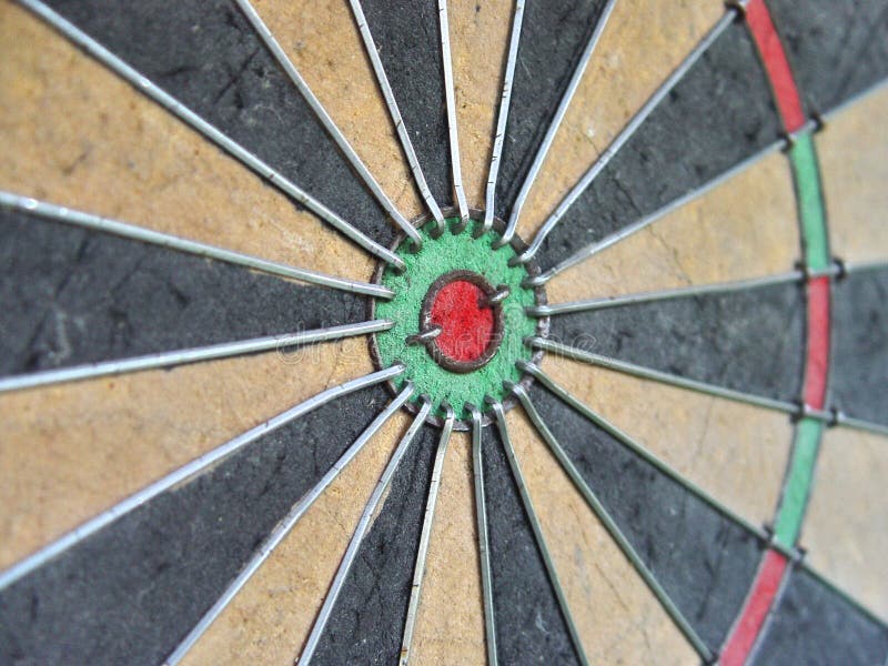 The Old Target with Darts in the Center on the Wood Wall Stock Image ...