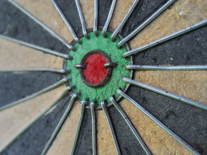 The Old Target with Darts in the Center on the Wood Wall Stock Image ...