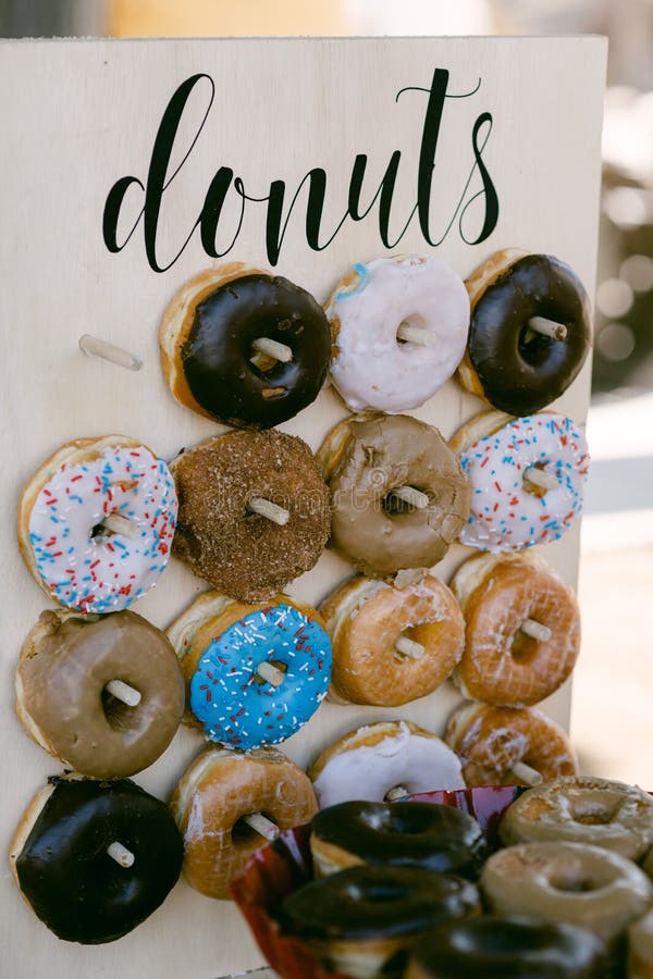 Tasty Donuts on Donut Wall, Vertical Shot Stock Photo - Image of season ...
