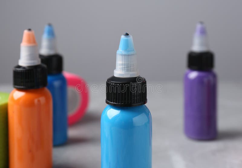 Colorful Tattoo Inks on Light Grey Table, Closeup Stock Photo - Image ...