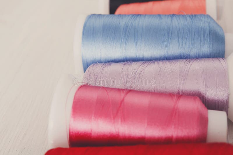 Colorful Thread Spools on Wooden Table Close Up Stock Photo - Image of ...