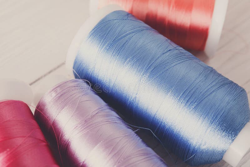 Colorful Thread Spools on Wooden Table Close Up Stock Image - Image of ...