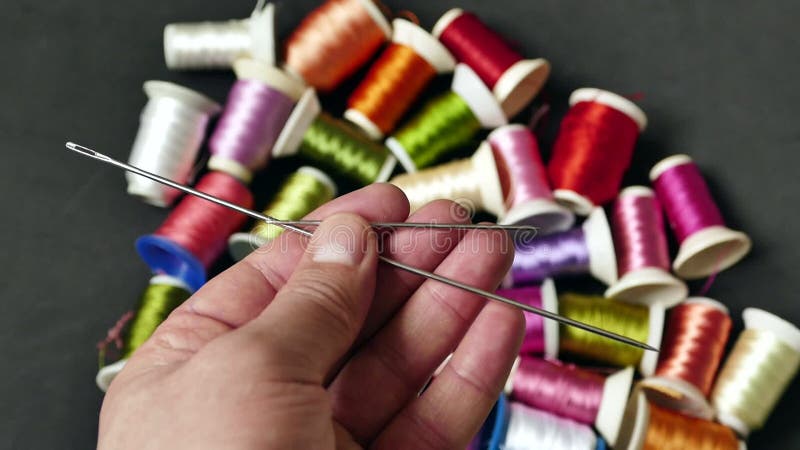 Colorful Thread Wound Bobbins, Large Needle and Small Sewing Needle ...
