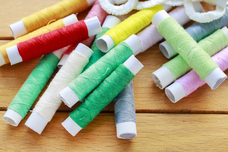 Colorful Threads on Wooden Table Stock Photo - Image of textile, green ...