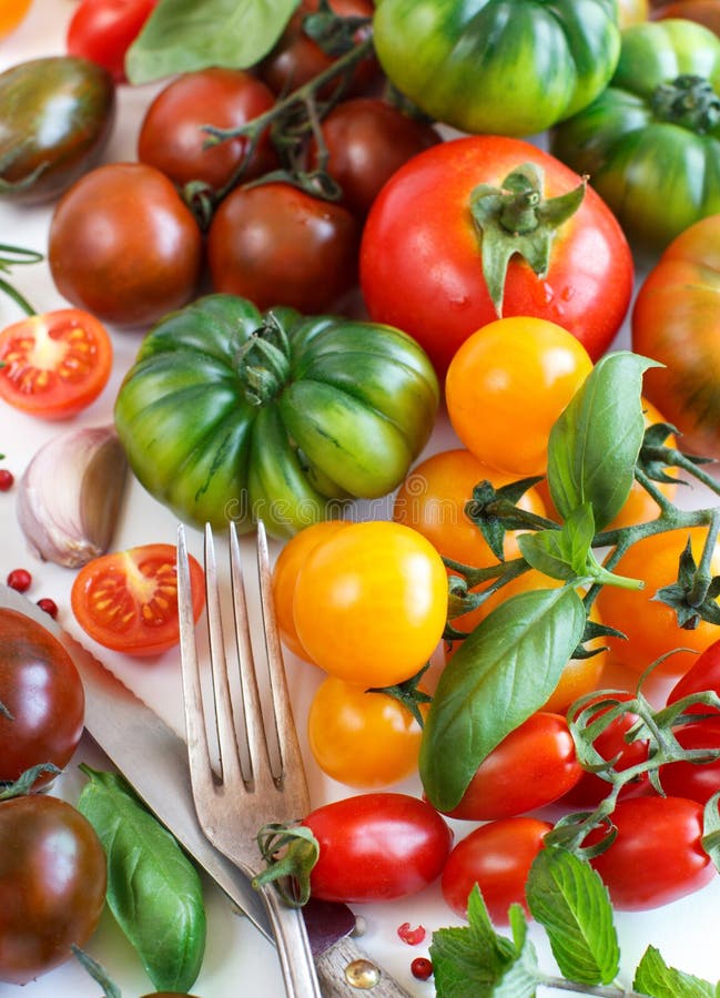 Colorful tomatoes stock image. Image of focus, basil - 72101593