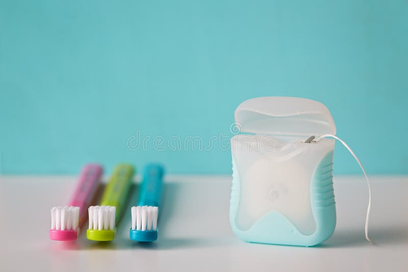 Colorful Toothbrushes And Dental Floss. Stock Image - Image of cord ...