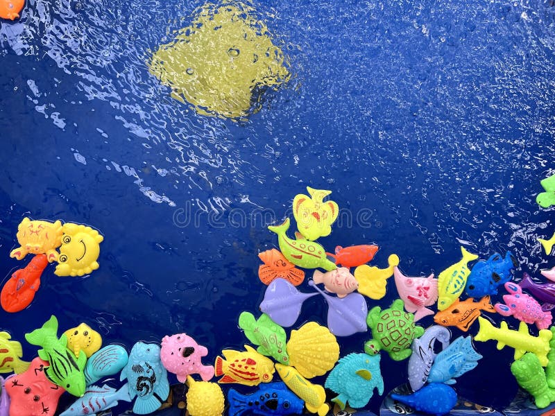 Colorful Toy Fish Floating Surface Blue Water Stock Photos - Free ...