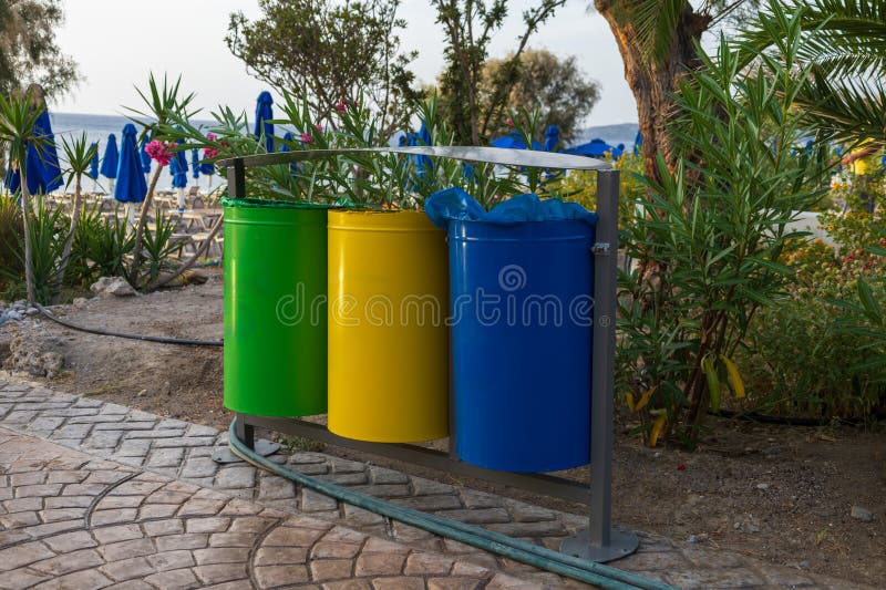 Colorful Trash Cans for Sorting Waste on the Beach Stock Image - Image ...