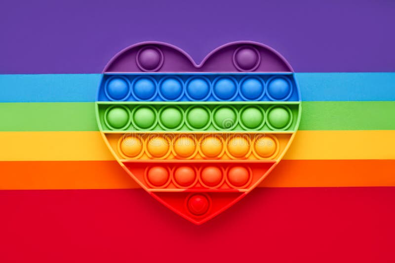 Colorful Trendy Pop It Fidgets Toy On A Rainbow Background Toy Anti