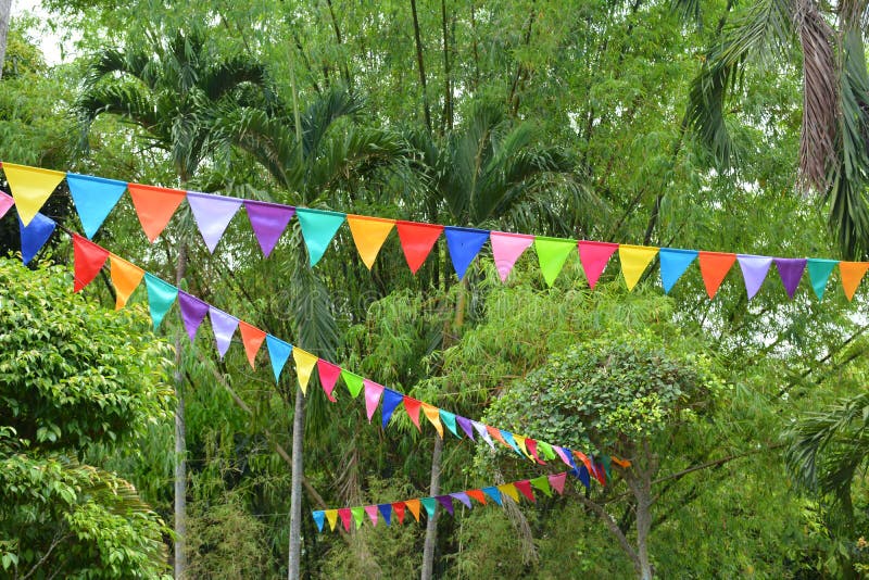 Colorful Triangle Banderitas Hanging at the Trees Stock Photo - Image ...