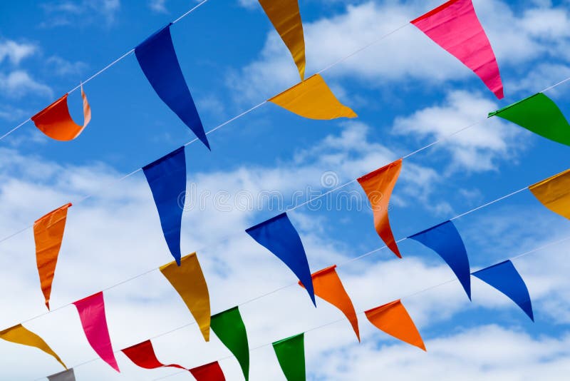 Colorful Triangular Flag Line Moving by Wind on Blue Sky White Cloud ...