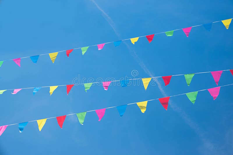 Colorful Triangular Flags on Three Lines, Blue Sky Background Stock ...