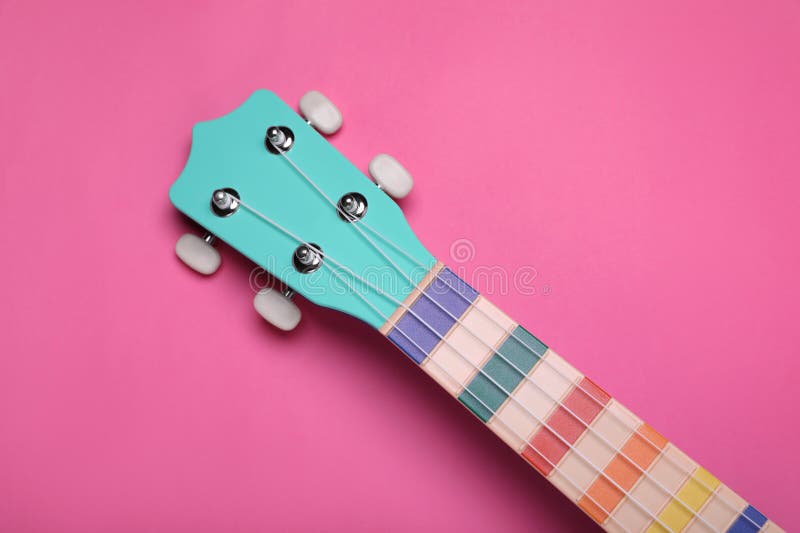 Colorful Ukulele Neck on Pink Background, Top View. String Musical ...