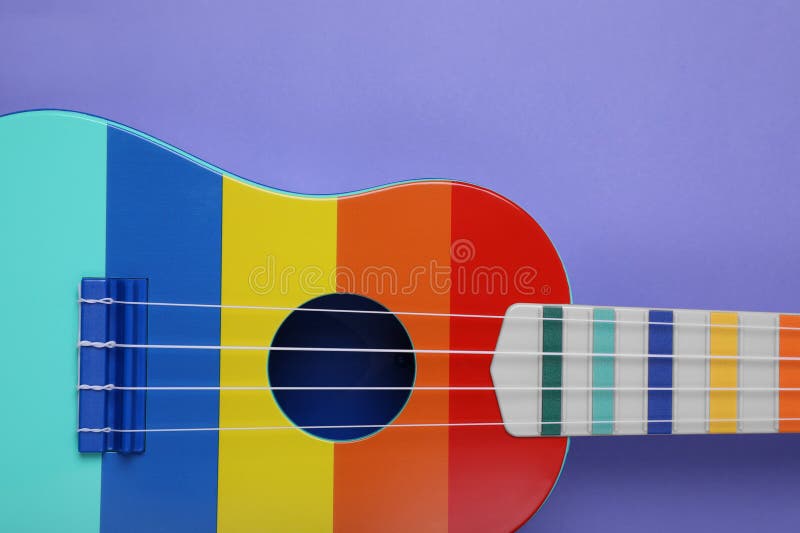 Colorful Ukulele on Purple Background, Top View. String Musical ...