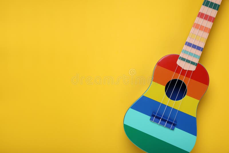 Colorful Ukulele on Yellow Background, Top View with Space for Text ...