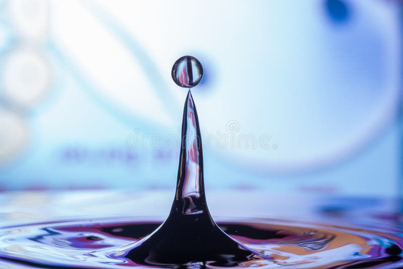 Water Drop Falling into Water Making a Concentric Circles Stock Photo ...