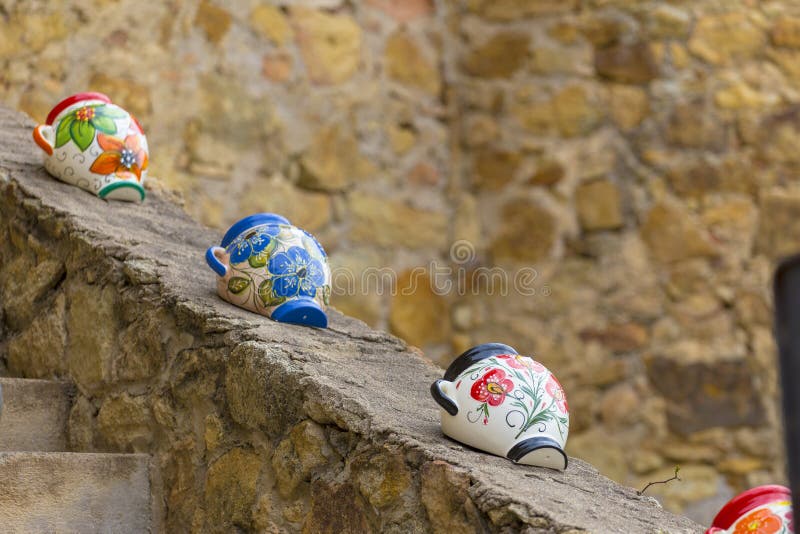 Colorful Water Pitcher in a Row on a Stone Wall Stock Photo - Image of ...