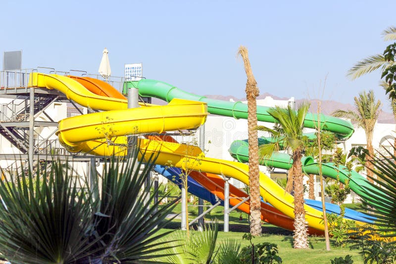 Colorful Water Slides in Tropical Aqua Park Stock Photo - Image of pool ...