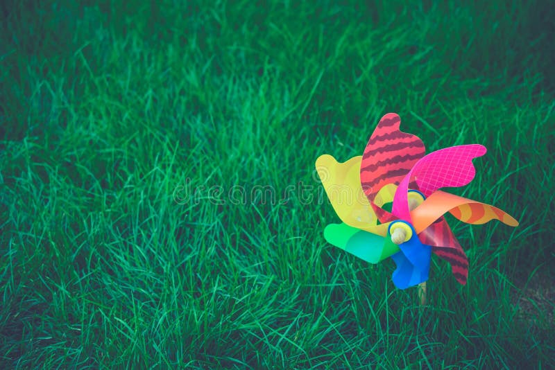 Colorful Wind Wheels on Green Grass with Blank Space Stock Photo ...