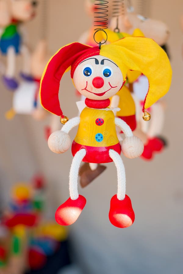 Colorful Wooden Buffoon Figure Hanging on the Spring Stock Photo ...