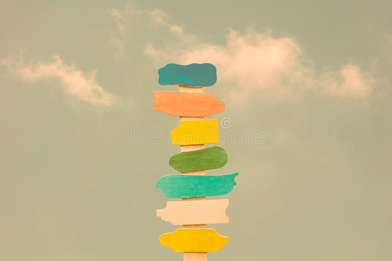 Wooden Direction Arrow Signs on a Wooden Pole Stock Photo - Image of ...