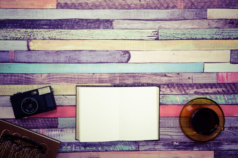 Colorful Wooden Table and Book, Coffee and Camera Stock Photo - Image ...