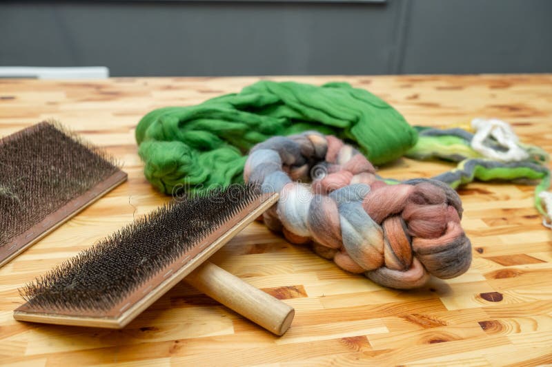Colorful Wool Roving and Carding Tools on Wooden Table Stock Image ...