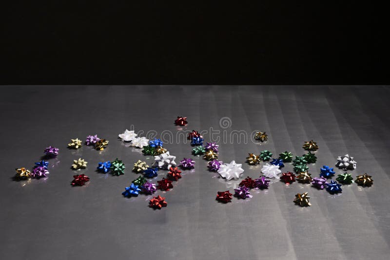 Colorful Wrapping Paper Stars Forming Patterns on Shiny Gray Texture ...