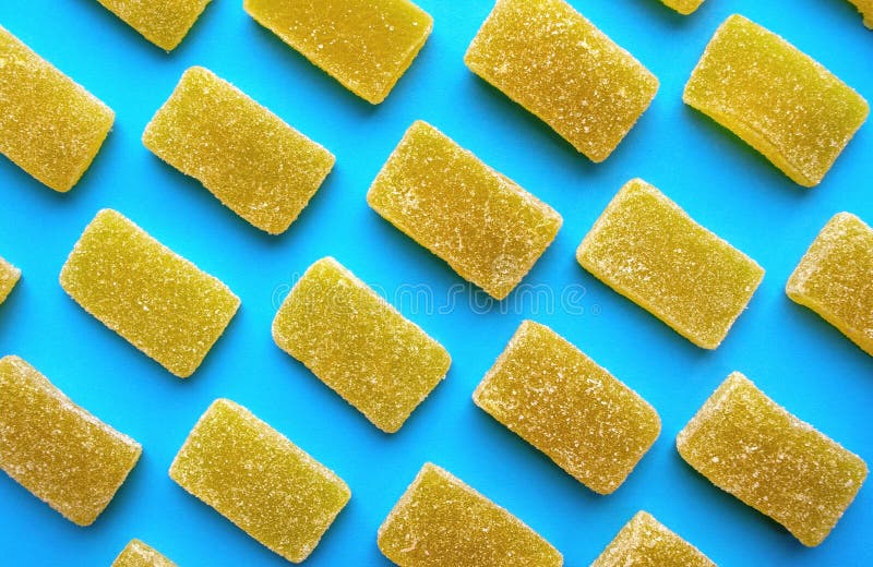 Yellow Jelly Candies Pattern on a Blue Background. Yellow Rectangular ...