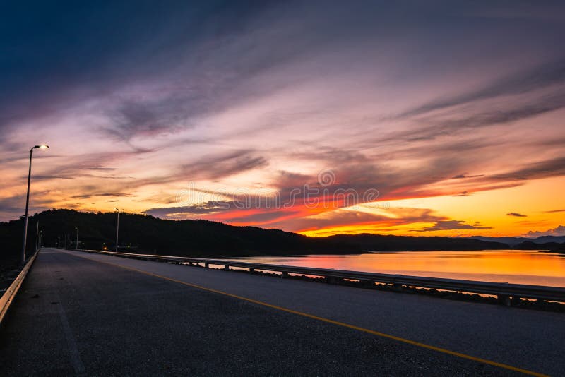 Colorfull Sunset Sky at Dam`s Lake with Road on Dam Ridge. Stock Photo ...