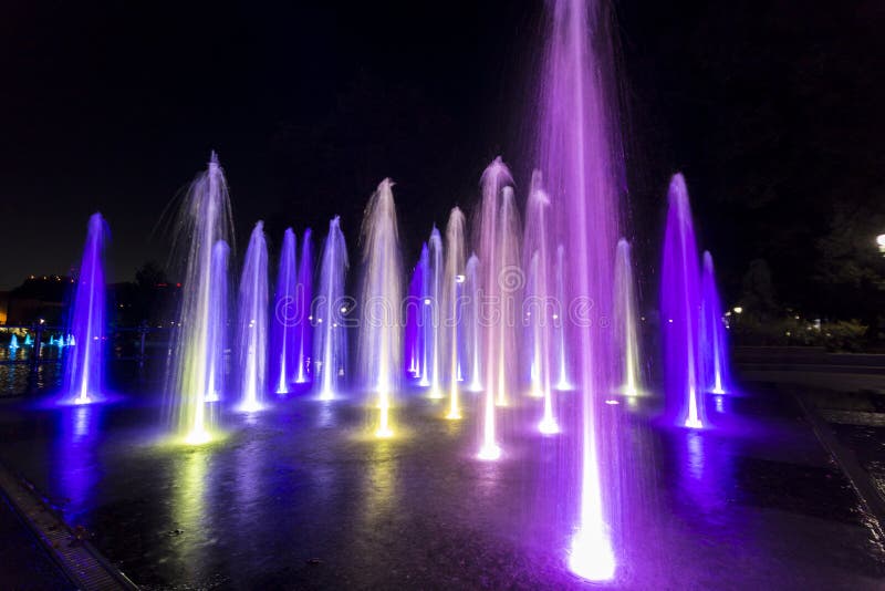 Colorfully lit fountain stock photo. Image of entertainment - 81135560