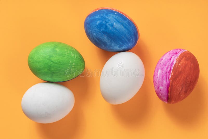 Colorfully Painted Easter Eggs are Displayed Against a Bright Orange ...